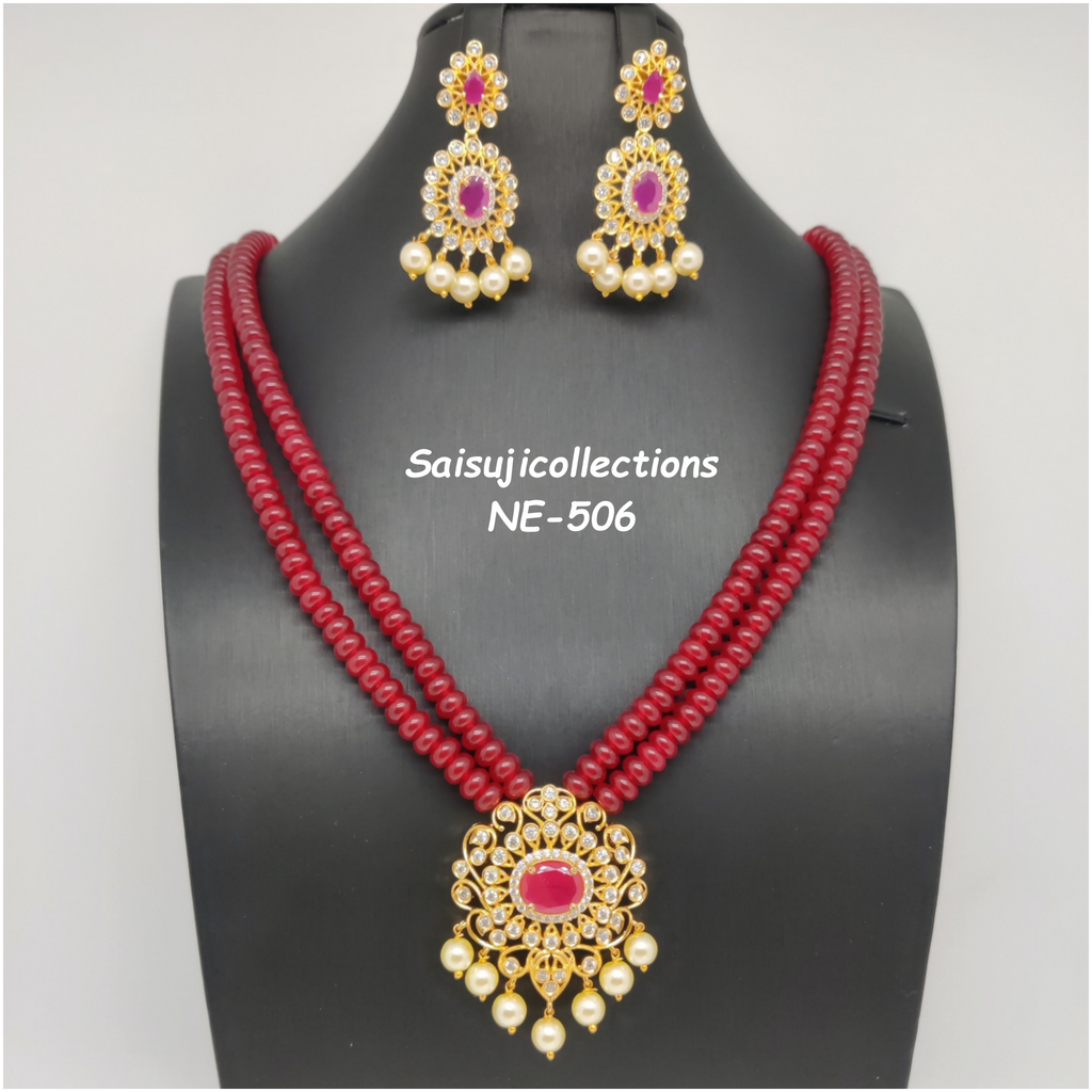 Beautiful 2 Lane Ruby Beads Mala With AD And Ruby Stone Locket And Ear SaiSuji Collections